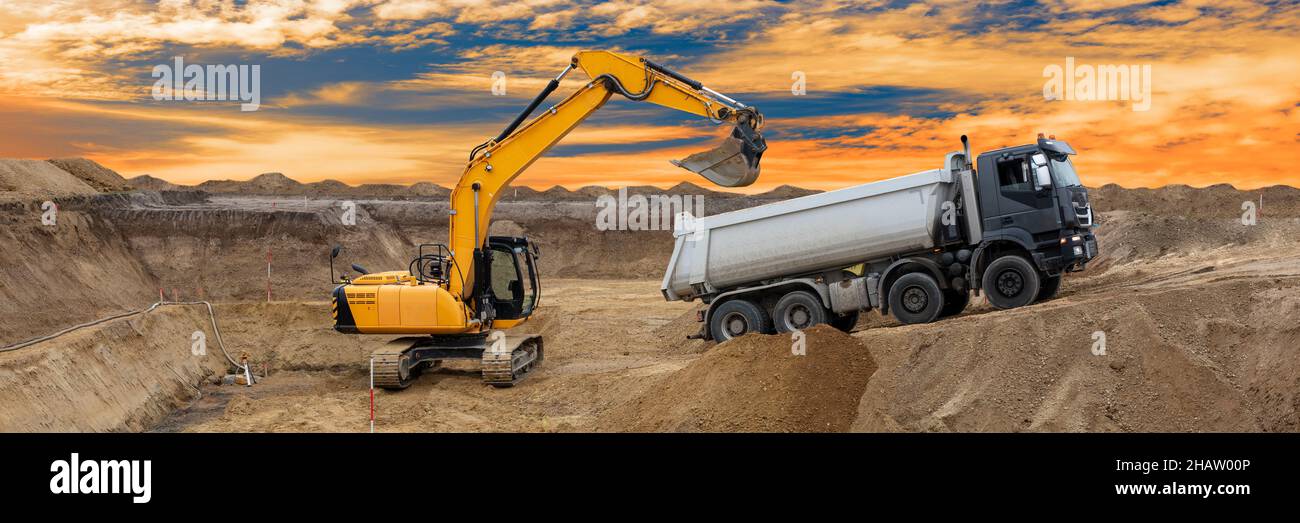 digger and excavator at work in construction site Stock Photo - Alamy