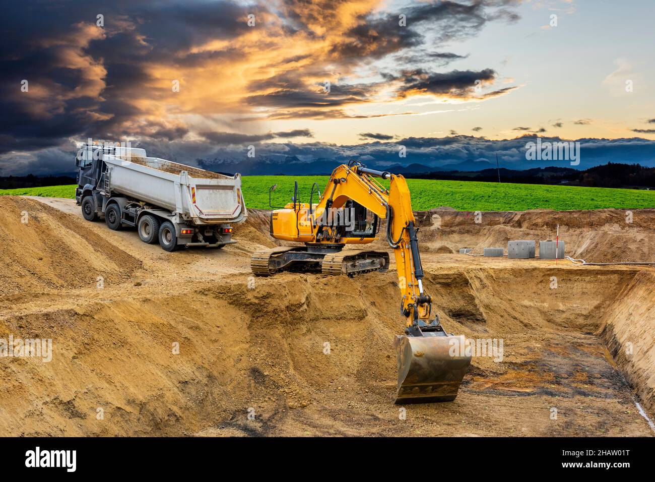 digger and excavator at work in construction site Stock Photo - Alamy