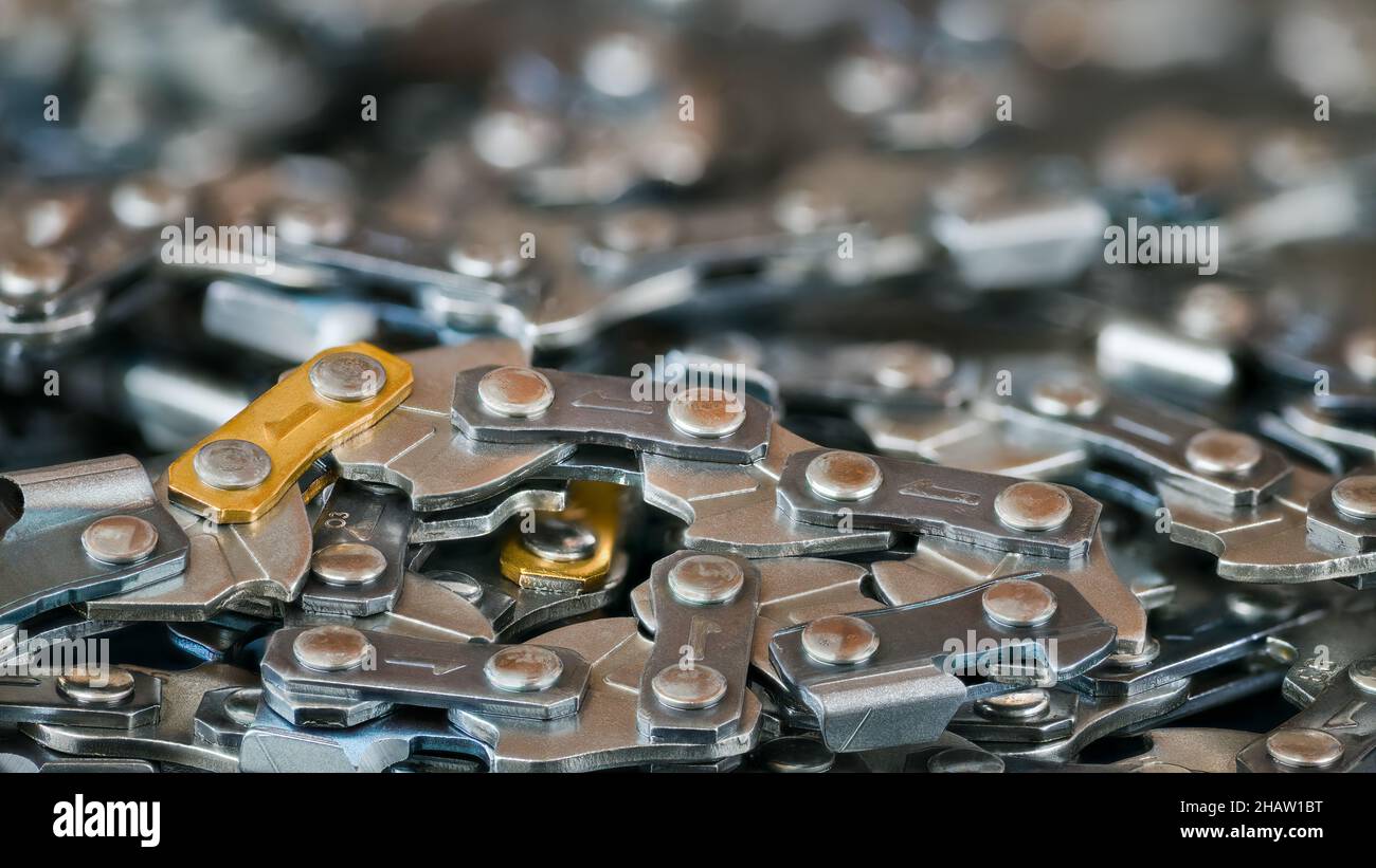 Tangled chainsaw chain texture with beautiful blurred background and ...