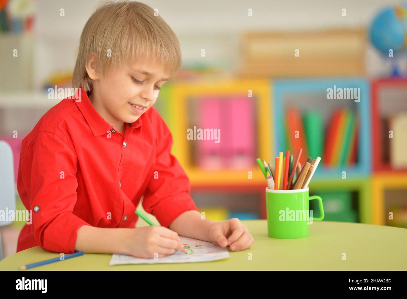 Portrait of cute little boy drawing Stock Photo - Alamy