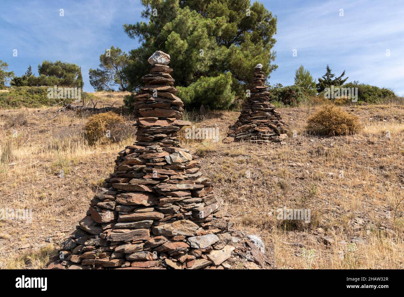 stone landmarks on a mountain on the costa brava on a hot summer day ...