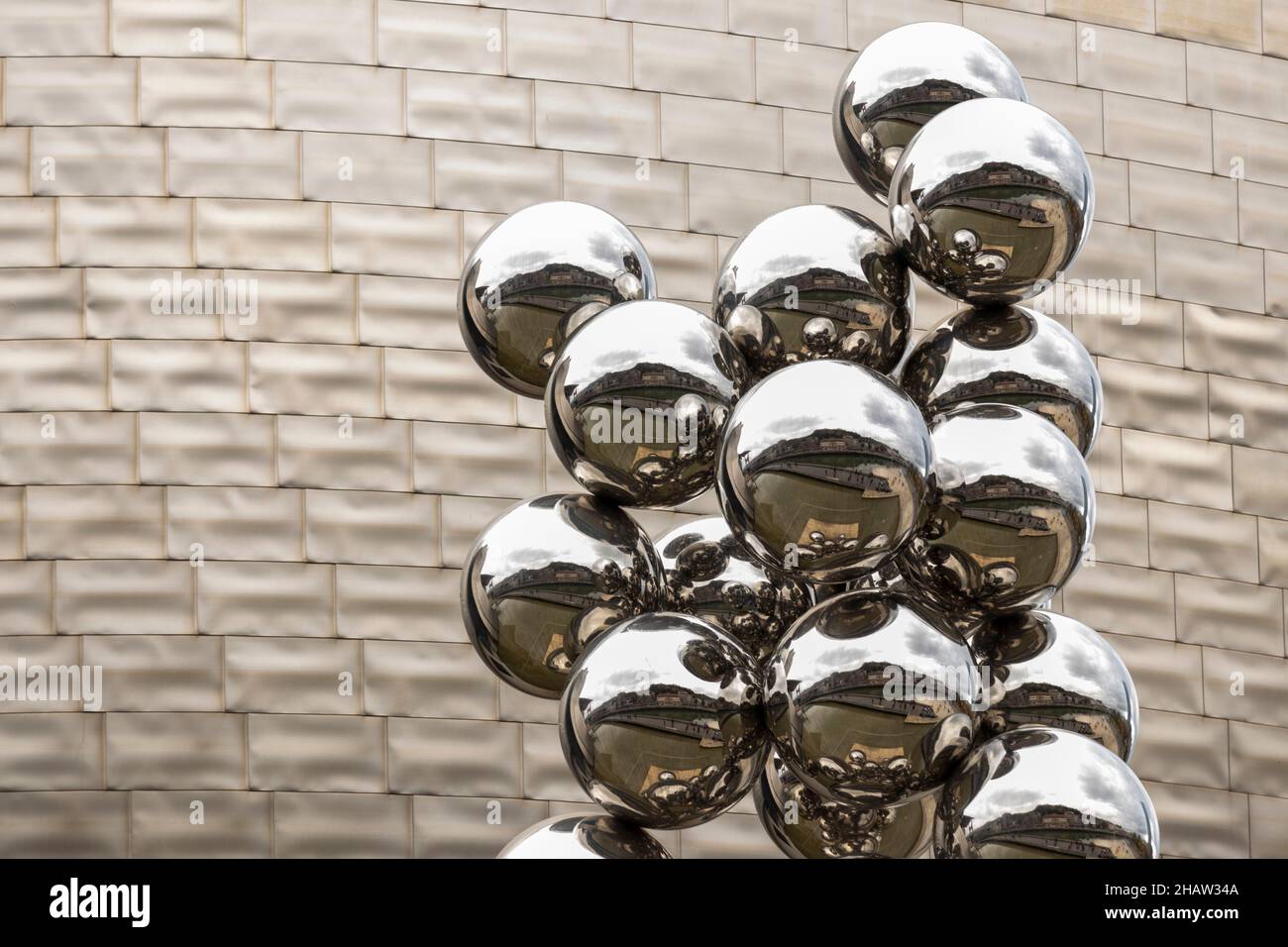 titanium facade of a museum of modern art in Bilbao, with some spheres ...