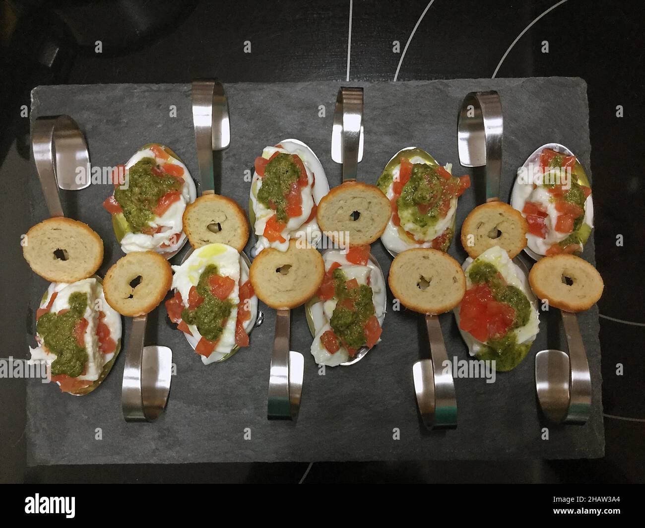 Amuse-gueule served on special spoons, mouth-pleaser (amuse-bouche ...