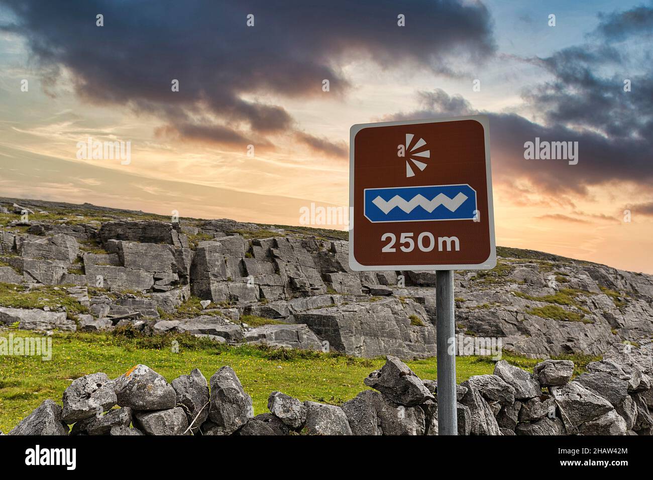 Wavy logo on a sign marks viewpoint in karst landscape, Irish coastal ...