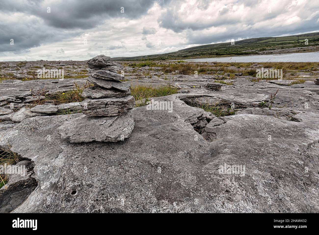 Stacked stones, cairns on bizarrely shaped limestone slabs, karst ...