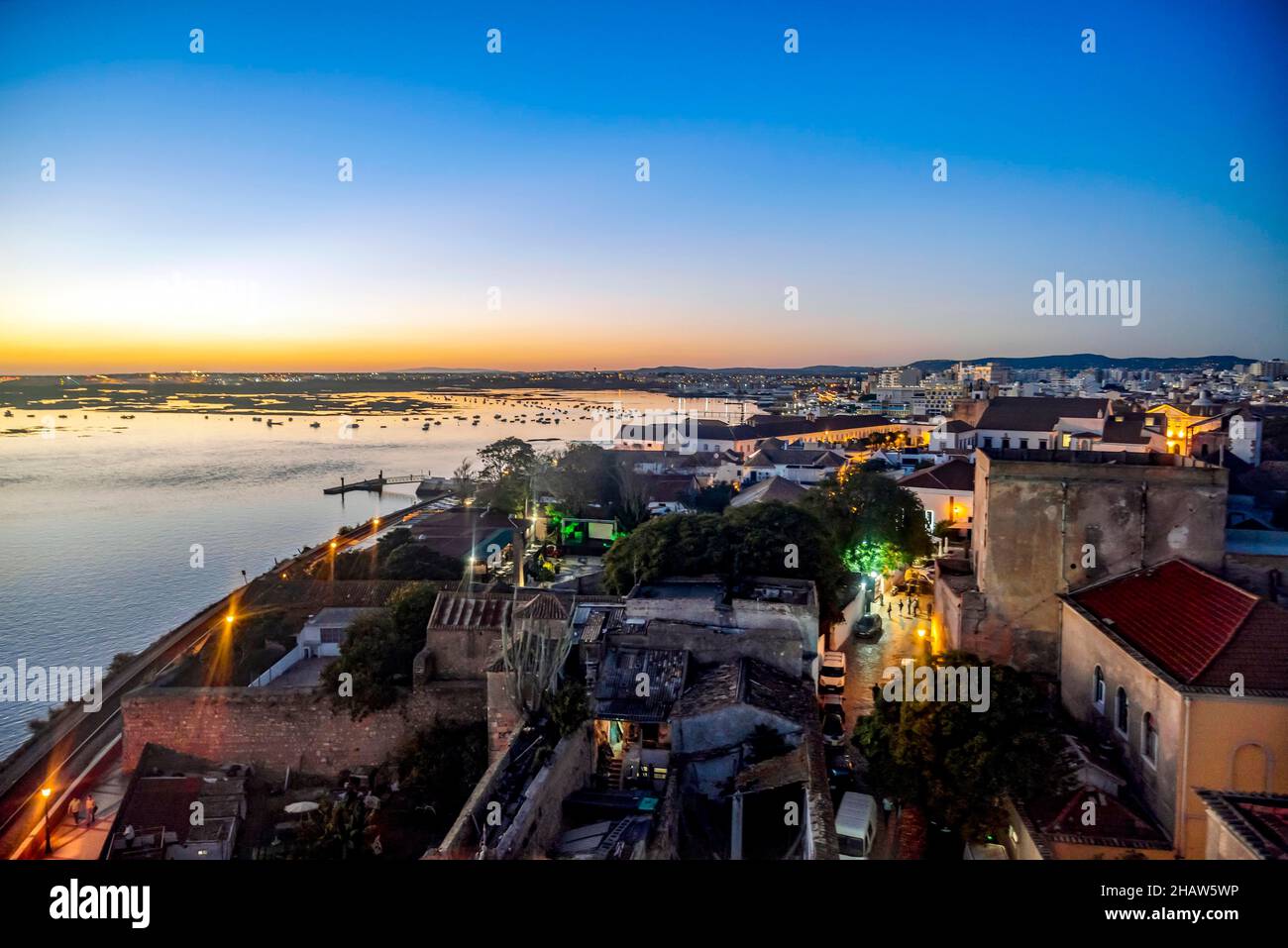 Faro cityscape by sunset, historic architecture and Ria Formosa ...