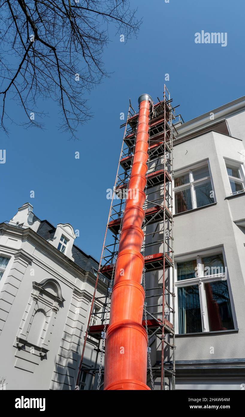 Scaffolding with slide for building rubble on a residential building ...