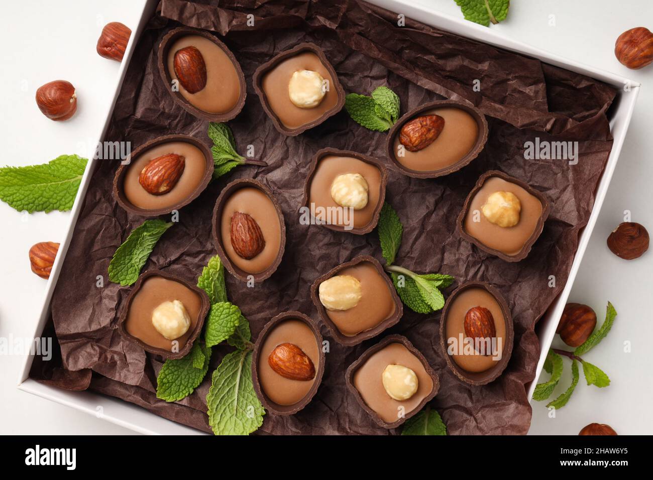 Concept of sweets with chocolate candies on white background Stock ...