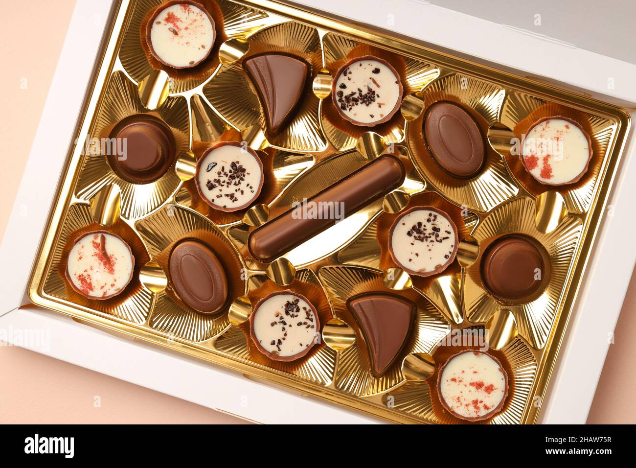 Concept of sweets with chocolate candies on beige background Stock ...