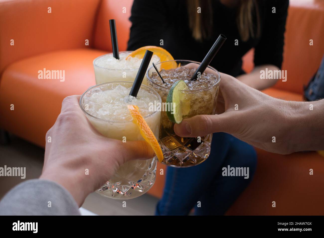 Hands holding cocktail hi-res stock photography and images - Alamy