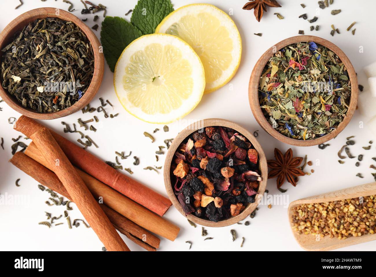 Concept of cooking tea with different types of tea on white background ...