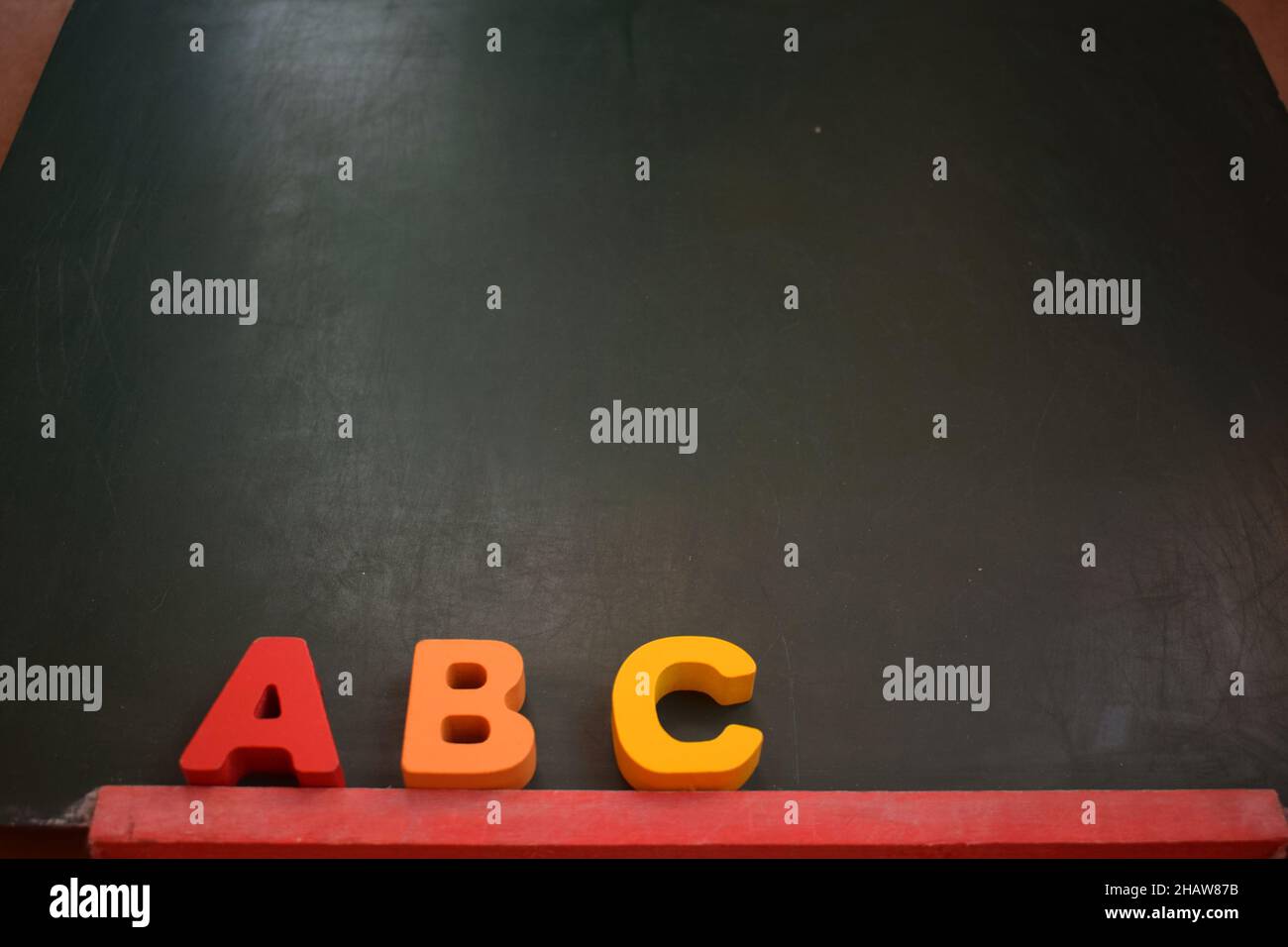 Wooden letters on the blackboard Stock Photo - Alamy