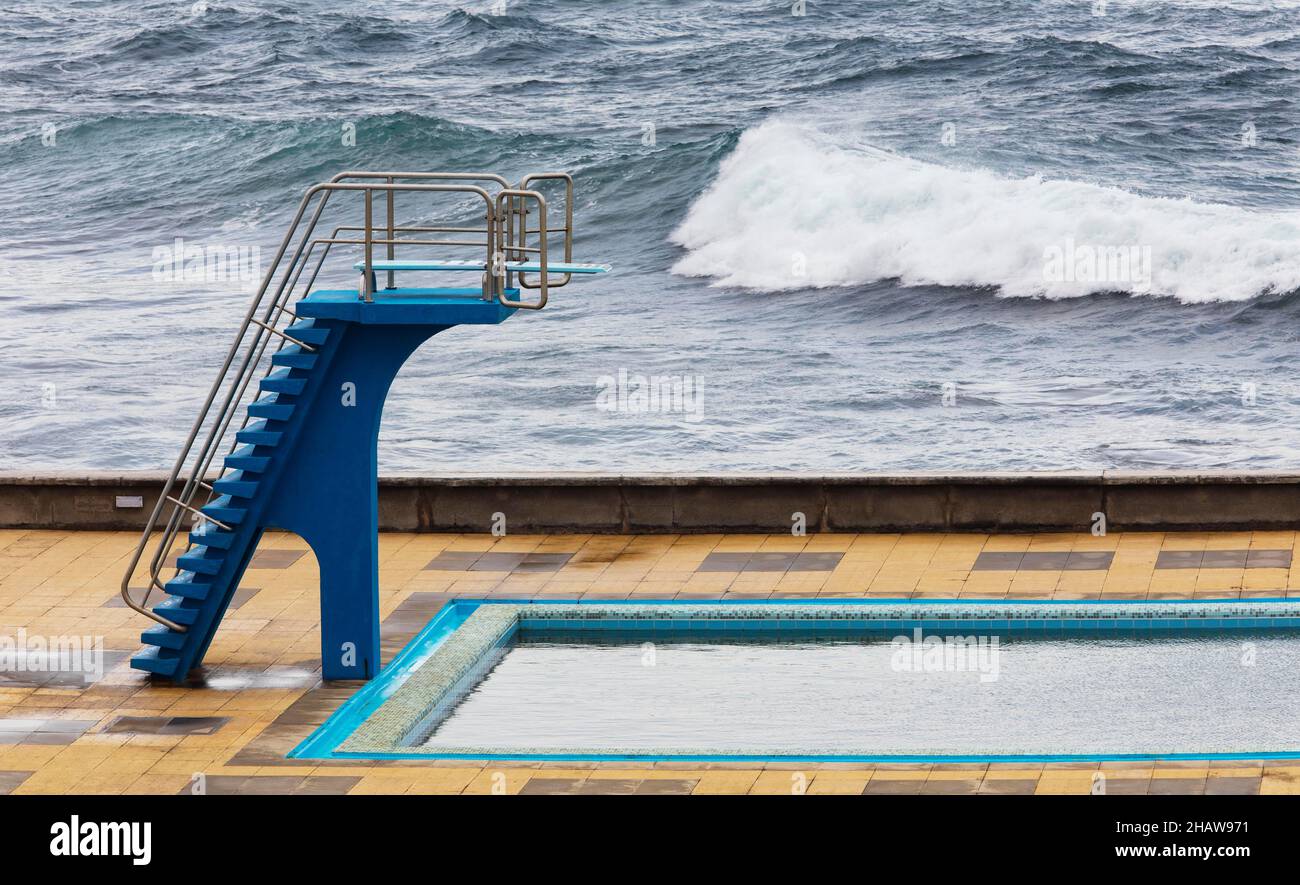 Swimming pool with diving tower on the Atlantic coast, Ribeira Grande ...