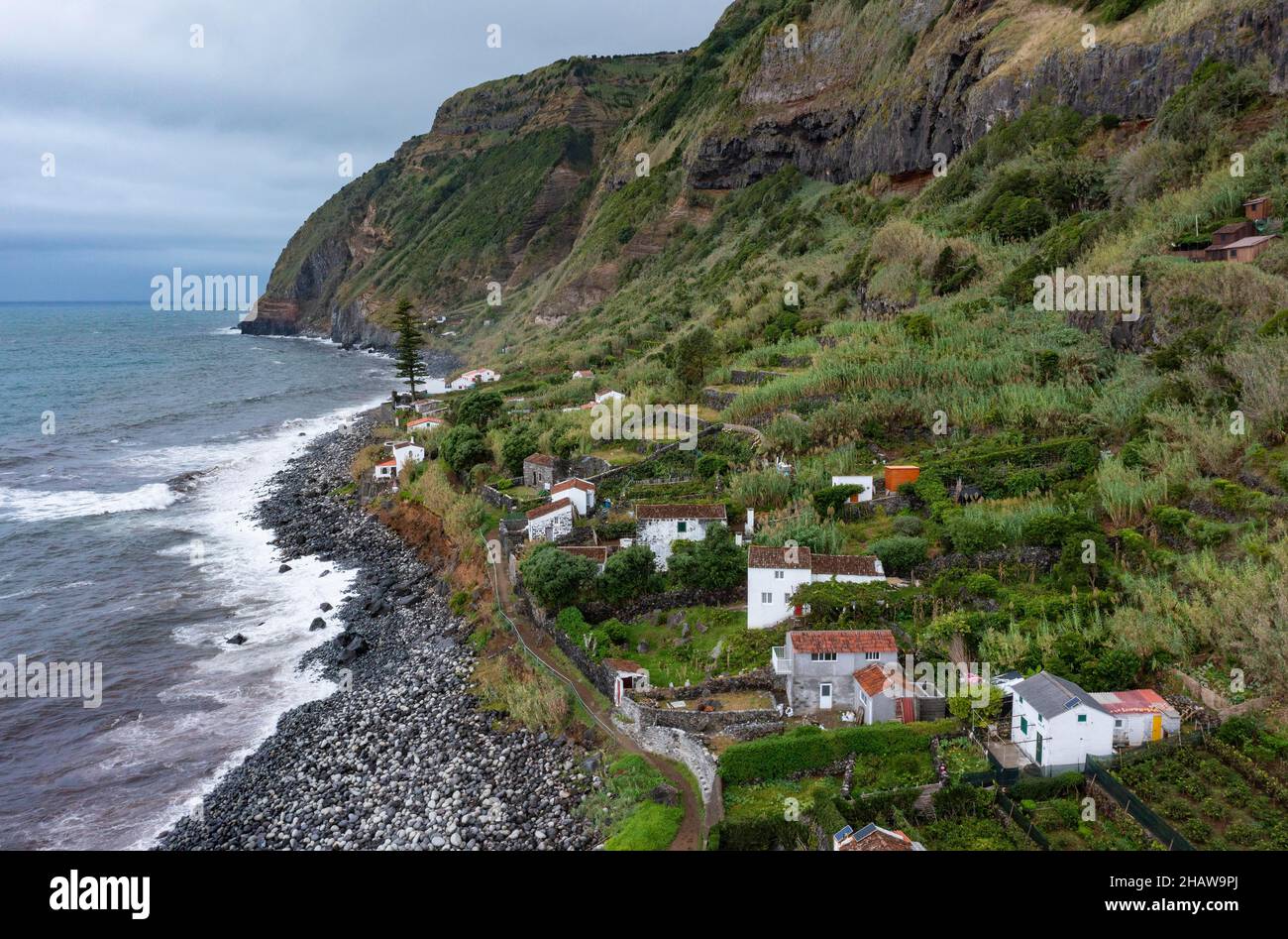 Drone shot, view of the cliff and settlement of Rocha da Relva, Sao ...
