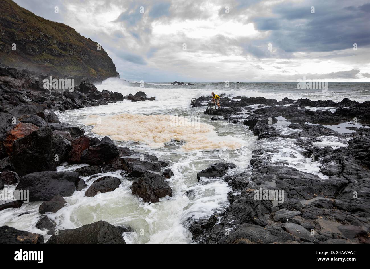Natural thermal bath Termas da Ferraria at high tide with high waves ...