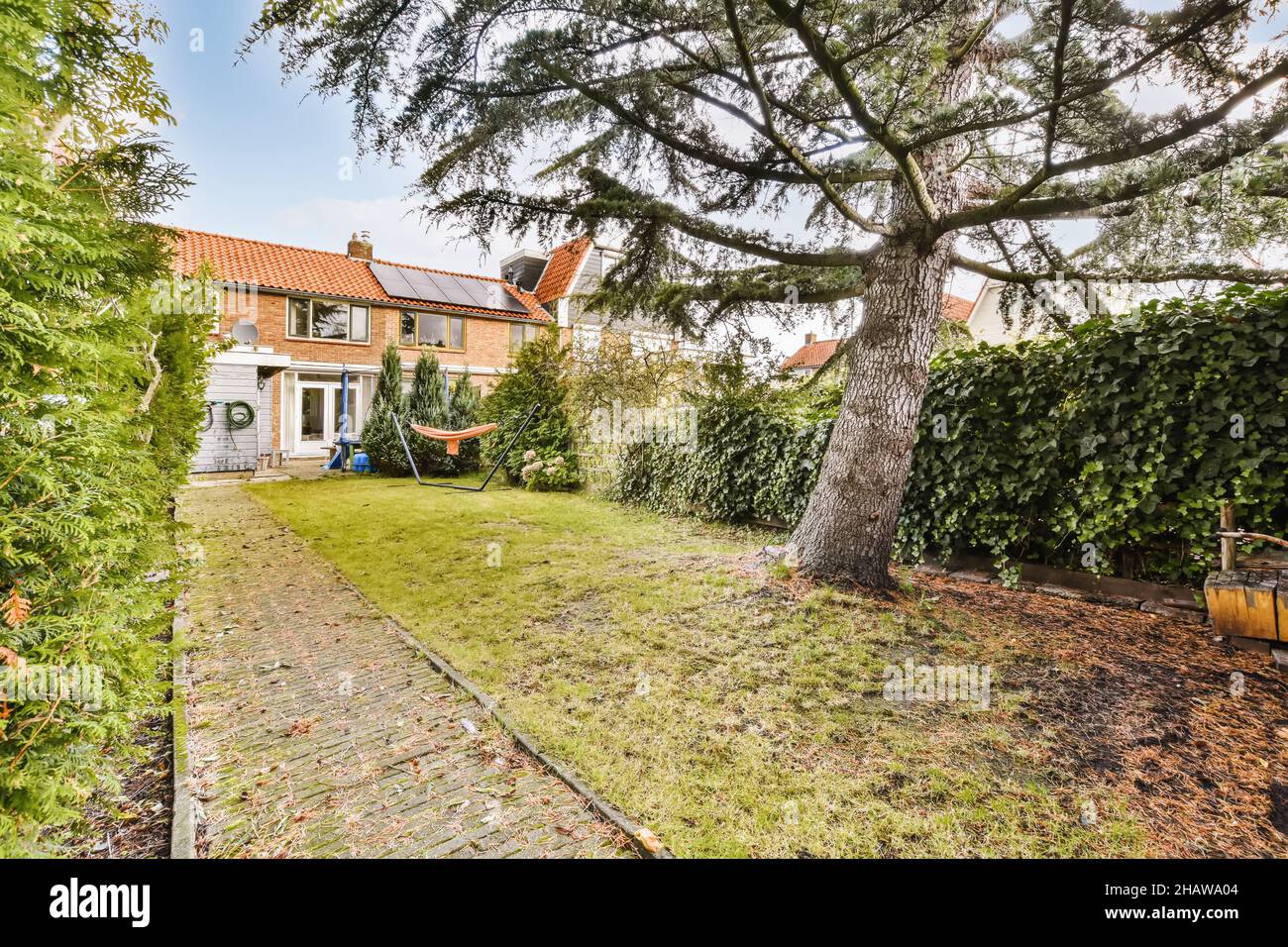 Superb courtyard with beautifully laid paths and trees Stock Photo - Alamy