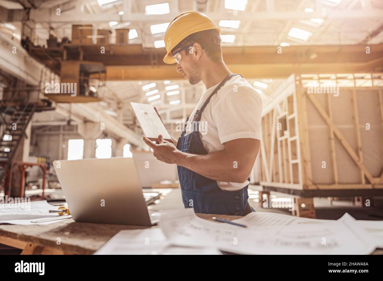 Handsome construction worker checking hi-res stock photography and ...