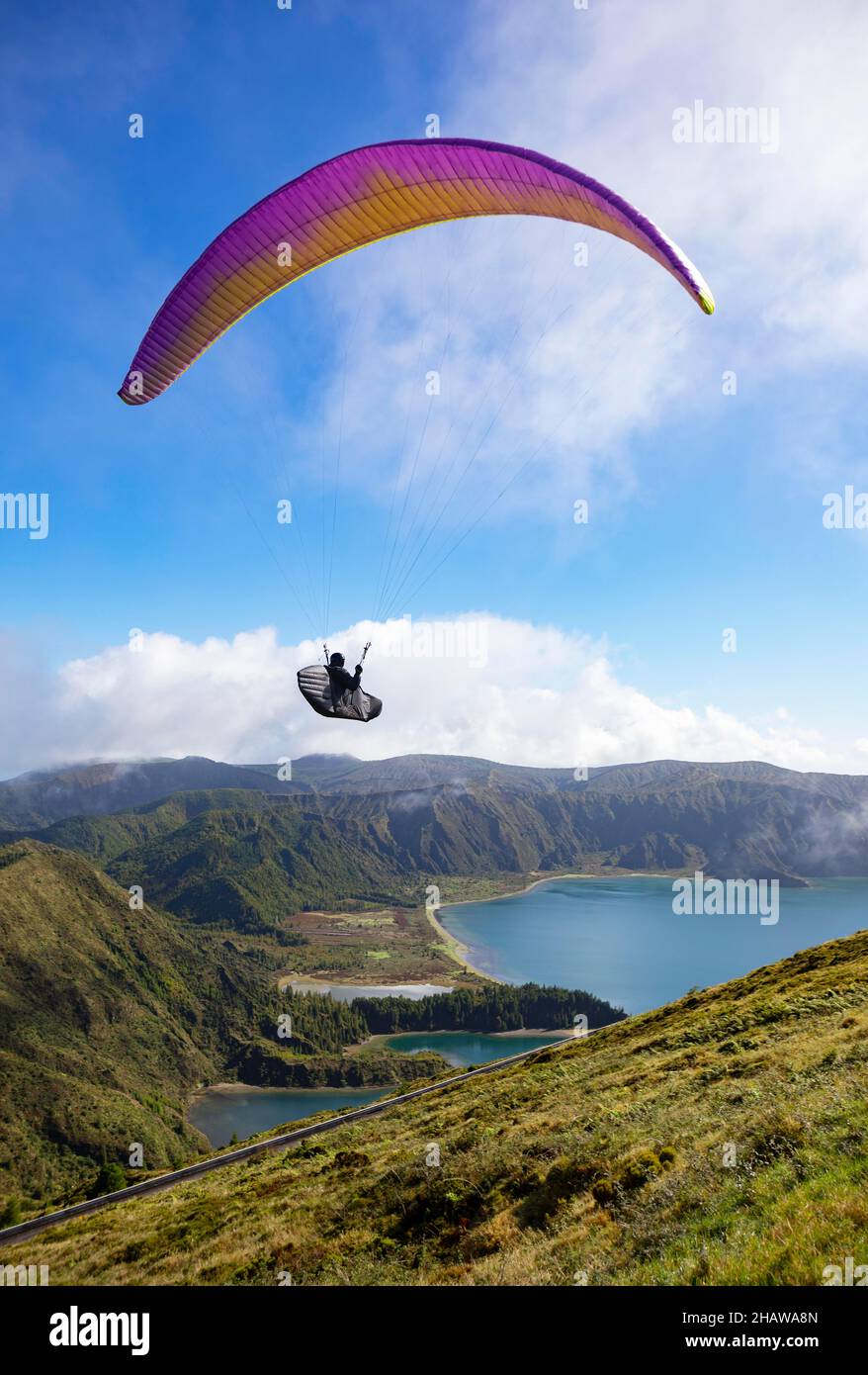 paraglider in flight over the crater lake Lagoa do Fogo, Sao Miguel ...