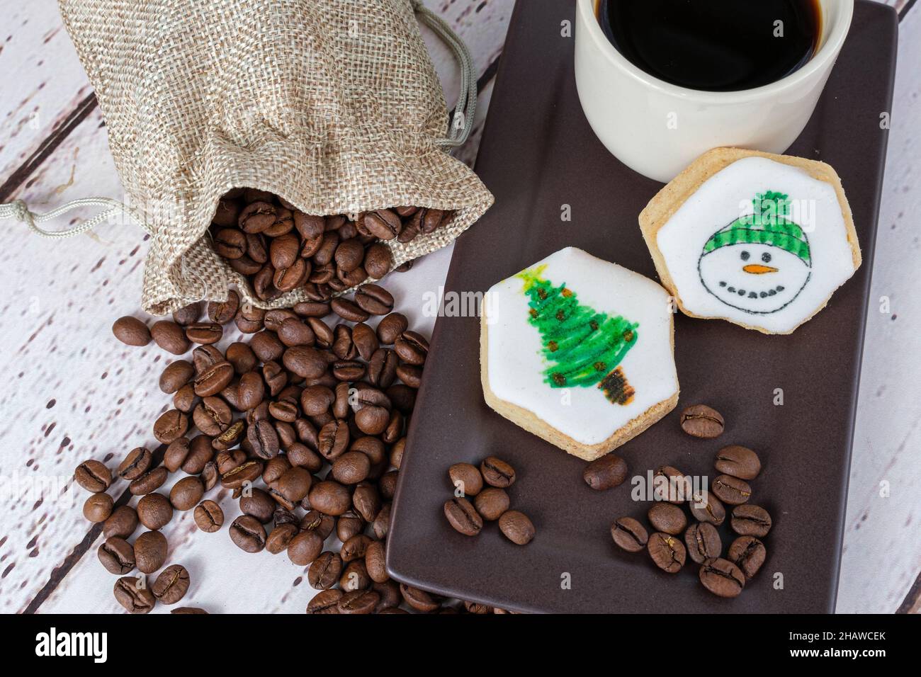 Closeup of buttery gout, with snowman sketch, next to coffee beans and ...