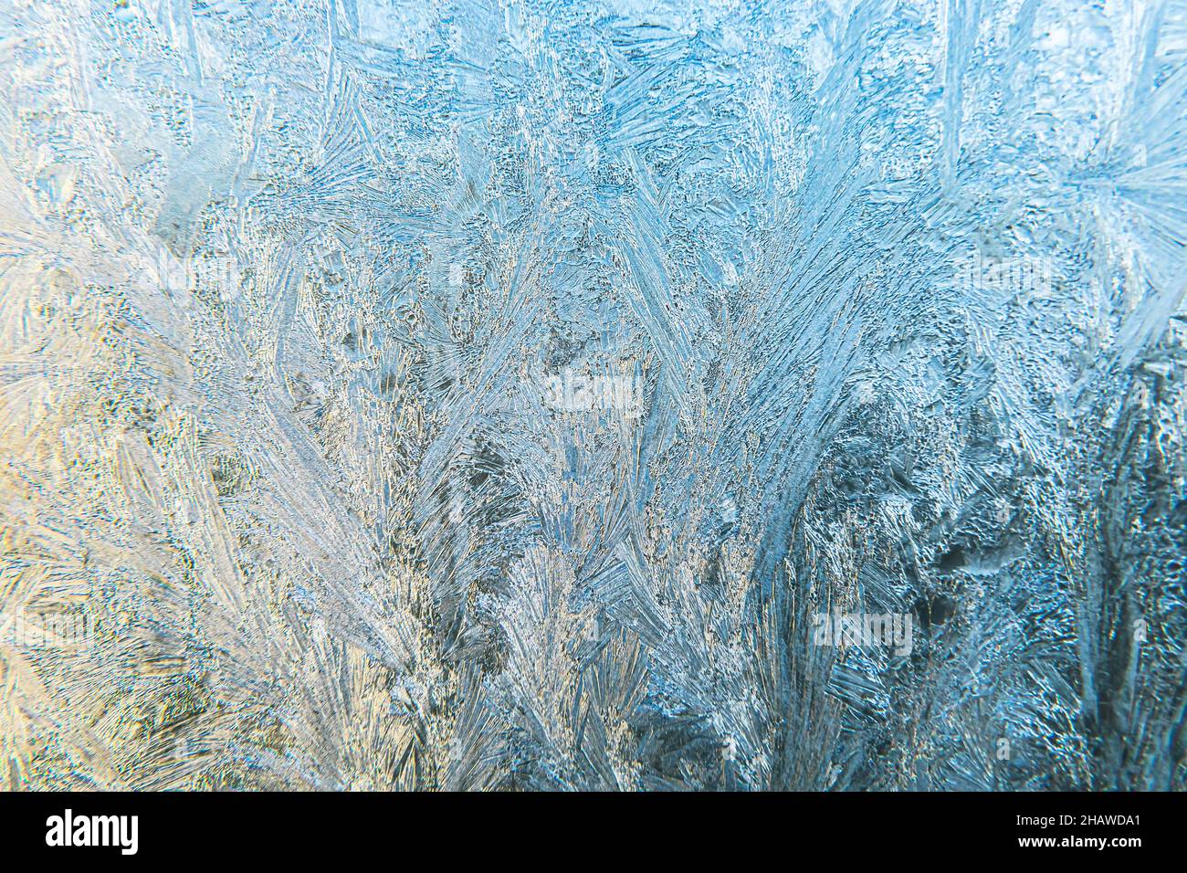 Frozen winter window with shiny ice frost pattern texture. Christmas ...