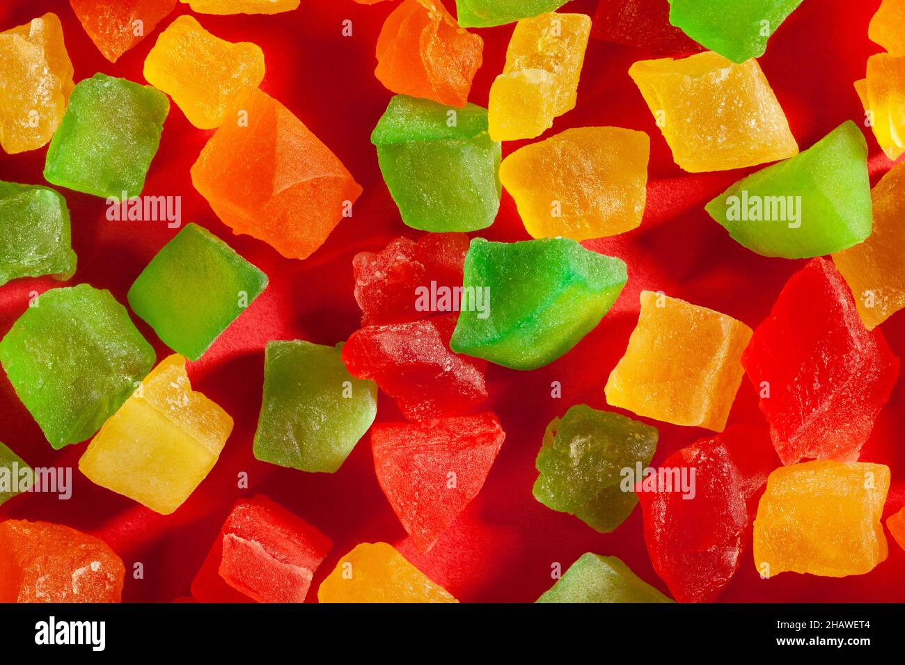 candied fruit on red background Stock Photo - Alamy