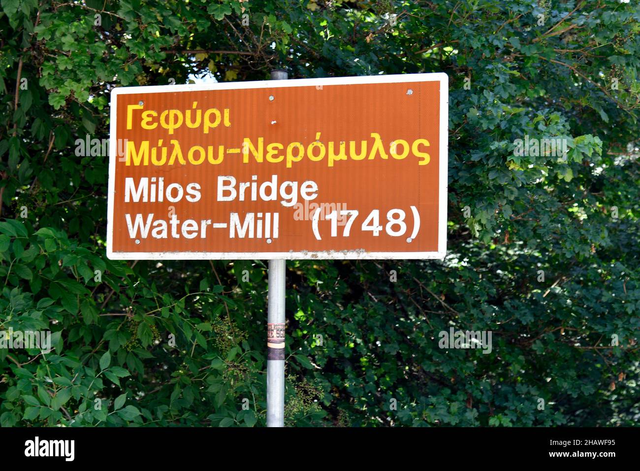 Greece, Epirus, signpost to the medieval Milos stone bridge and water ...