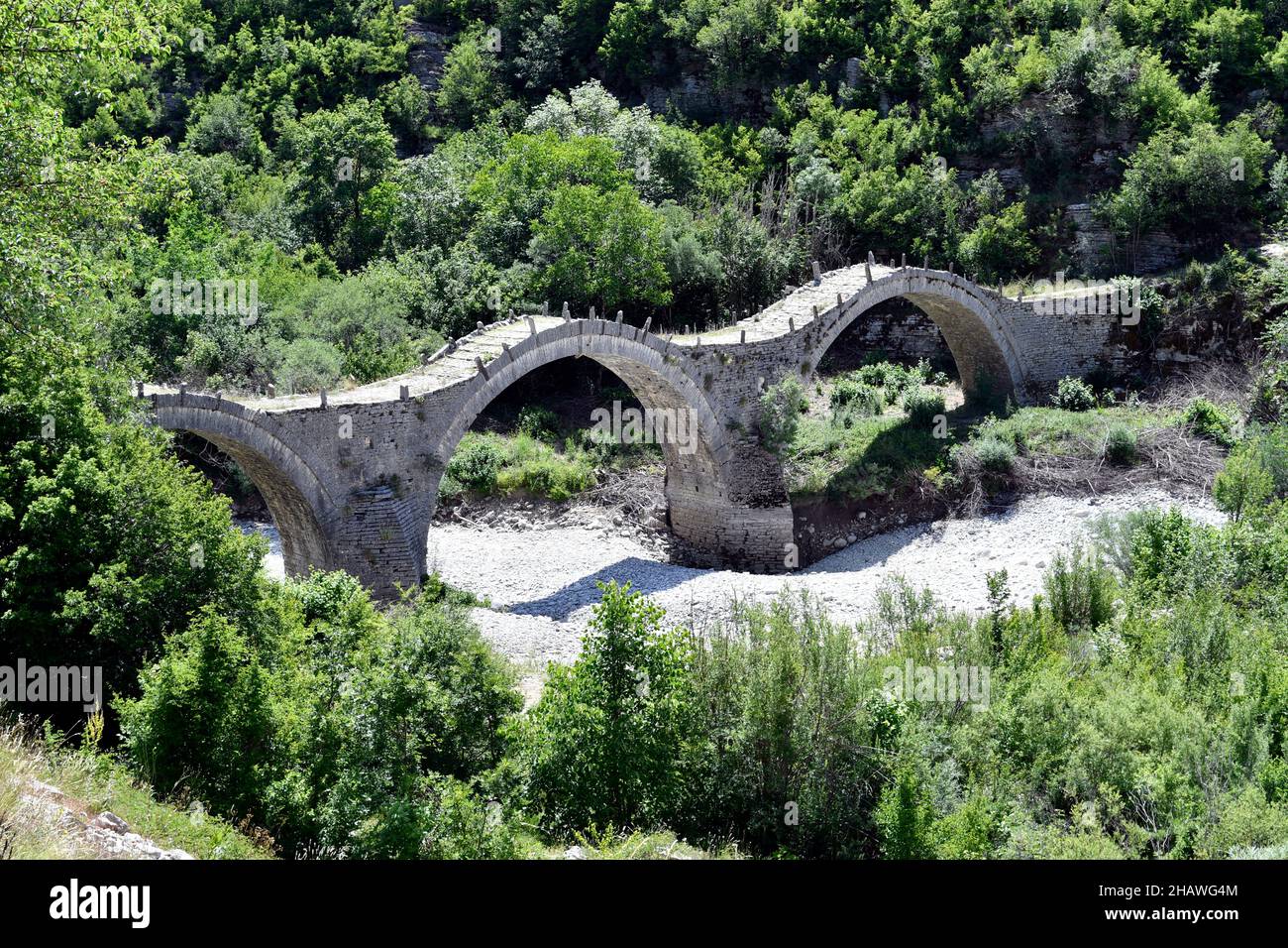 Greece, ancient stone bridge - bridge of Plakidas - over dry Voidomatis ...