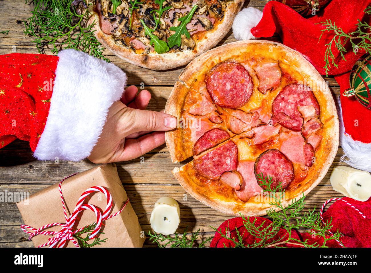 Christmas decorated background with pepperoni and mushrooms pizza,with ...