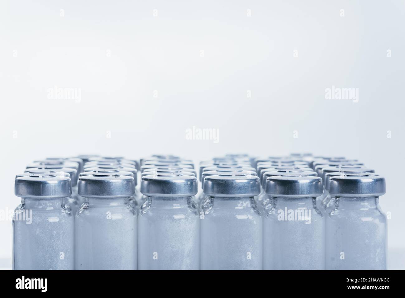 Glass medical ampoule vial for injection. Medicine is dry white drug ...