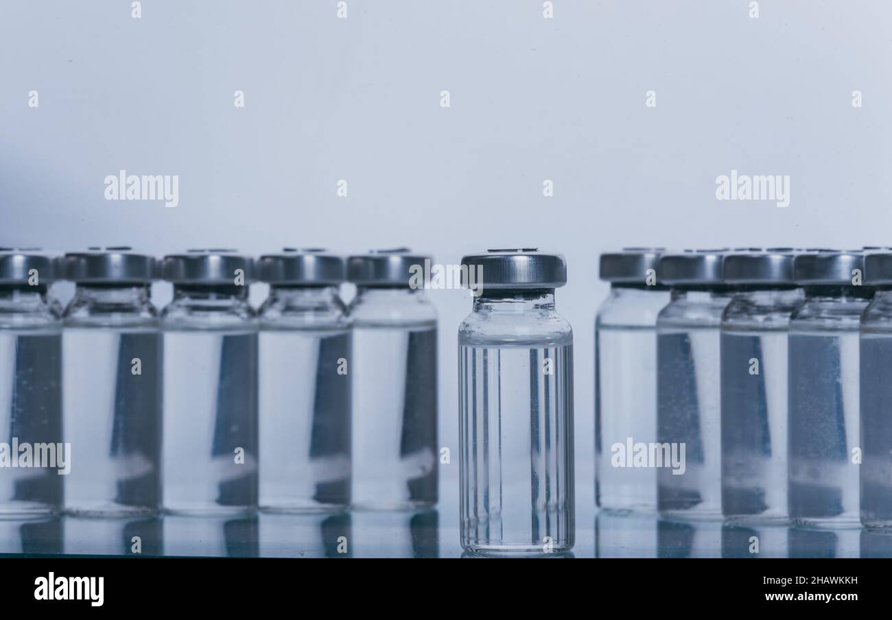 Glass medical ampoule vial for injection. Medicine is dry white drug ...