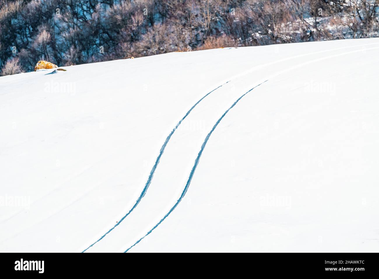 Car tracks in deep snow Stock Photo - Alamy