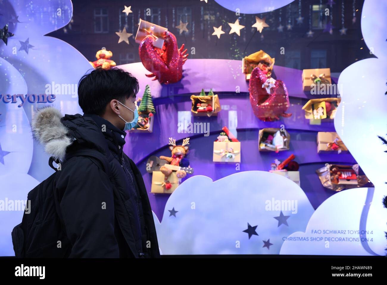 A shopper looks at a window display at Selfridges on Oxford Street ...