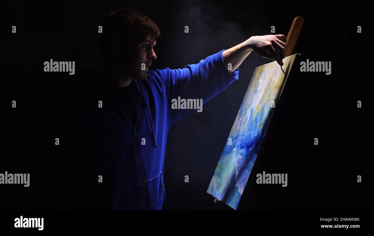 Artist copyist paint seascape with ship in ocean. Vaper smoke vape e ...