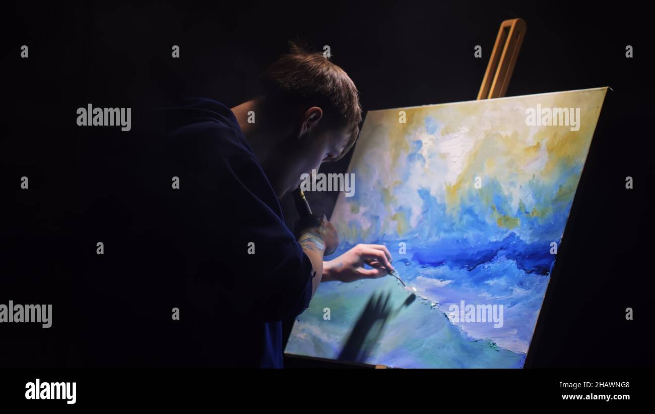Artist copyist paint seascape with ship in ocean. Vaper smoke vape e ...