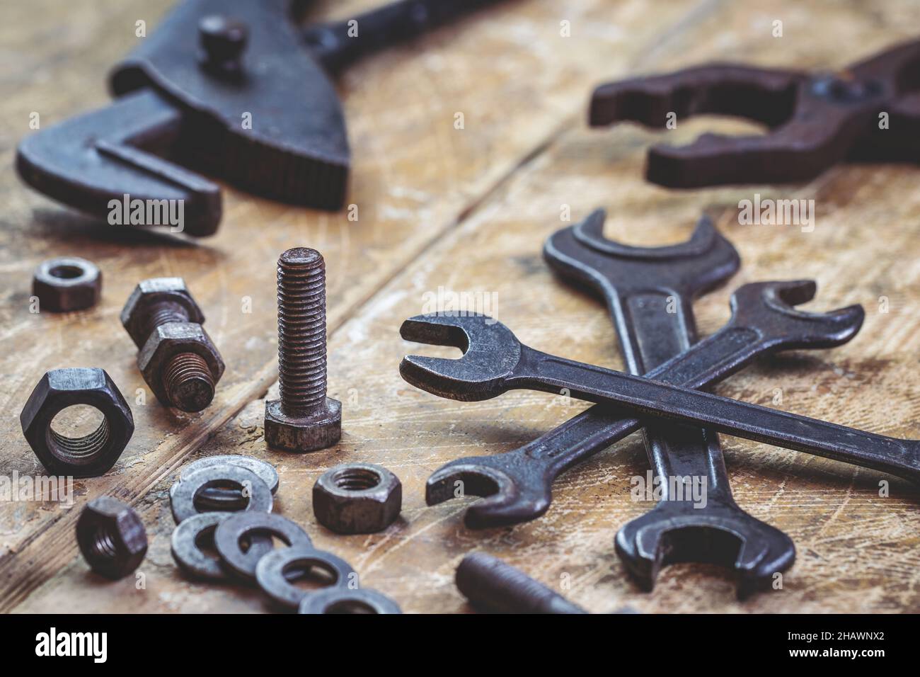 Vintage work tools. Old metal spanner, pliers and adjustable wrench on ...