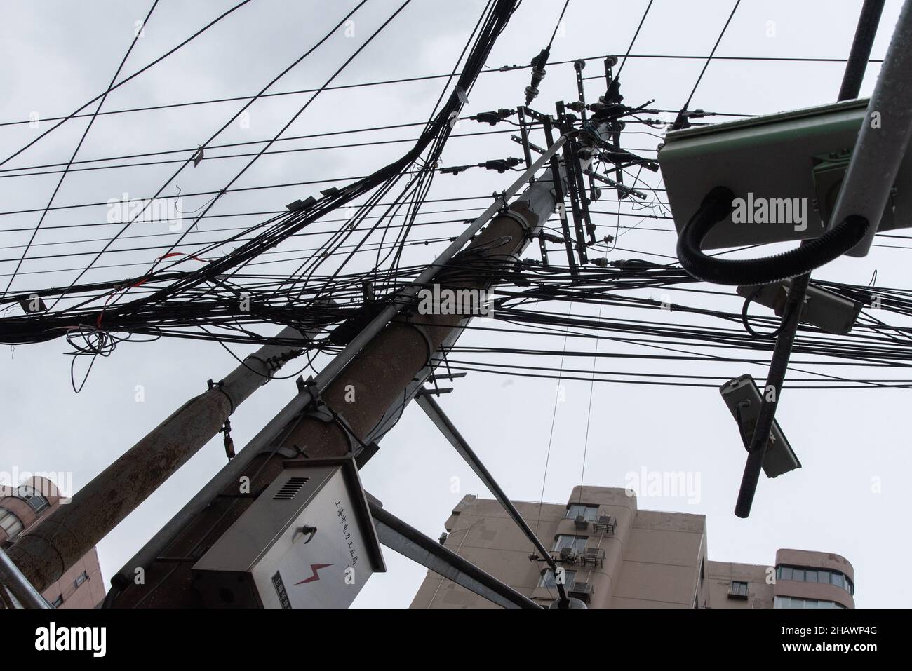Shanghai, China - February, 2019. Messy tangle of electrical and ...