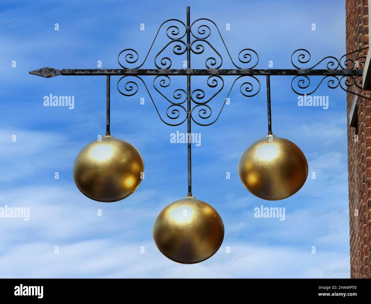 Pawn shop close up traditional sign three gold balls above Pawnbroker ...