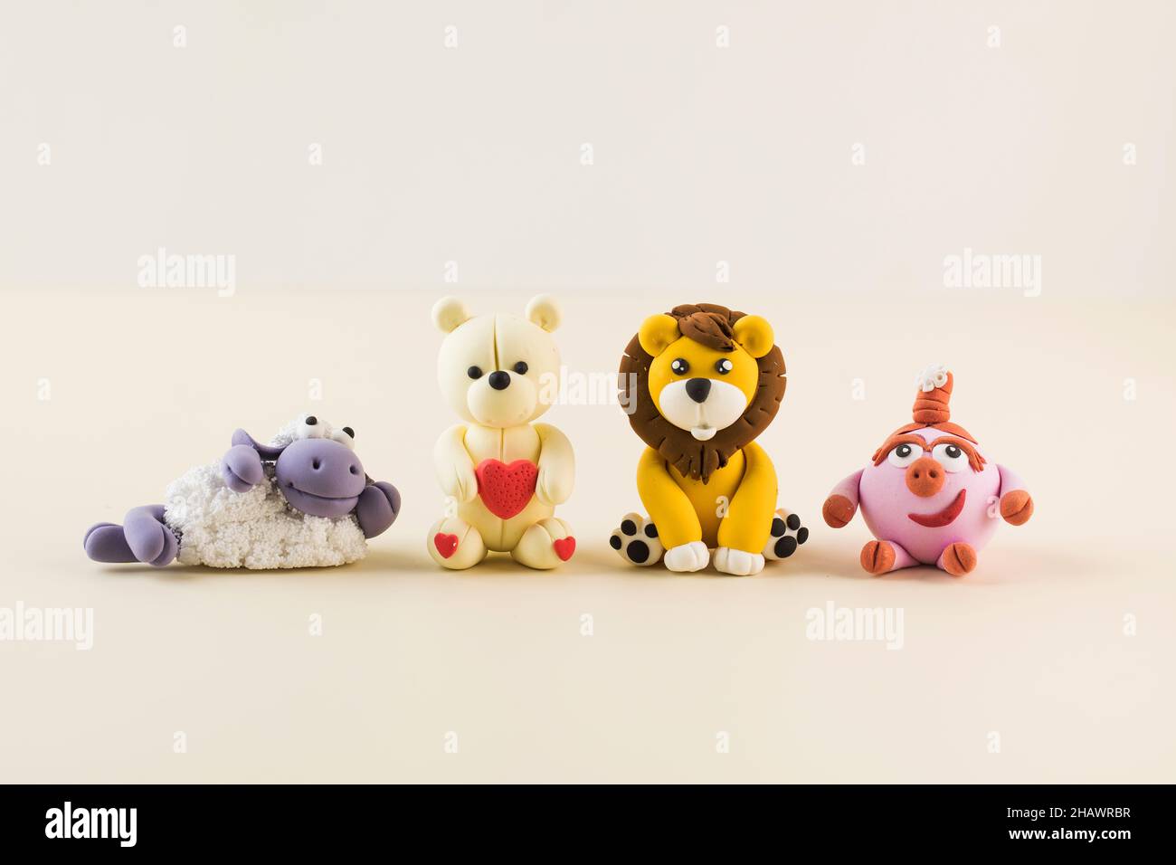 Group of cute small toy figures of children cartoon characters on light ...