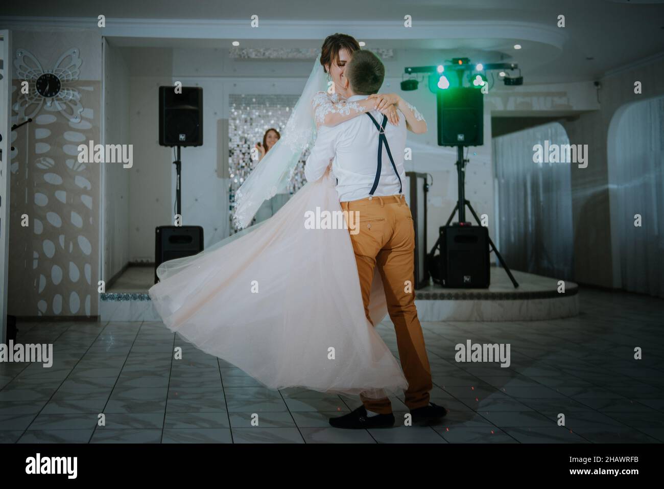 beautiful caucasian couple just married and dancing their first dance ...