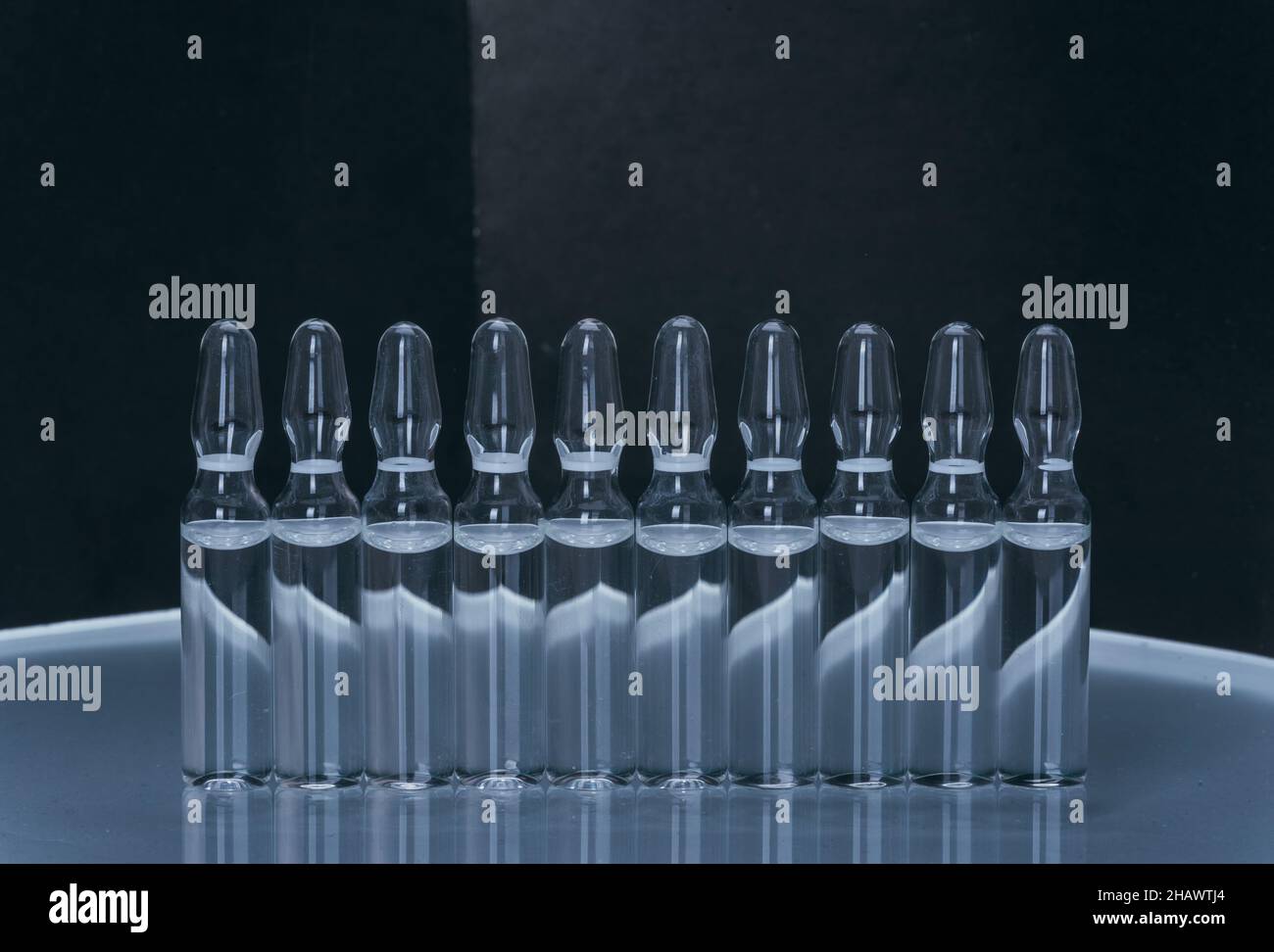 Glass medical ampoule vial for injection. Medicine is liquid sodium ...