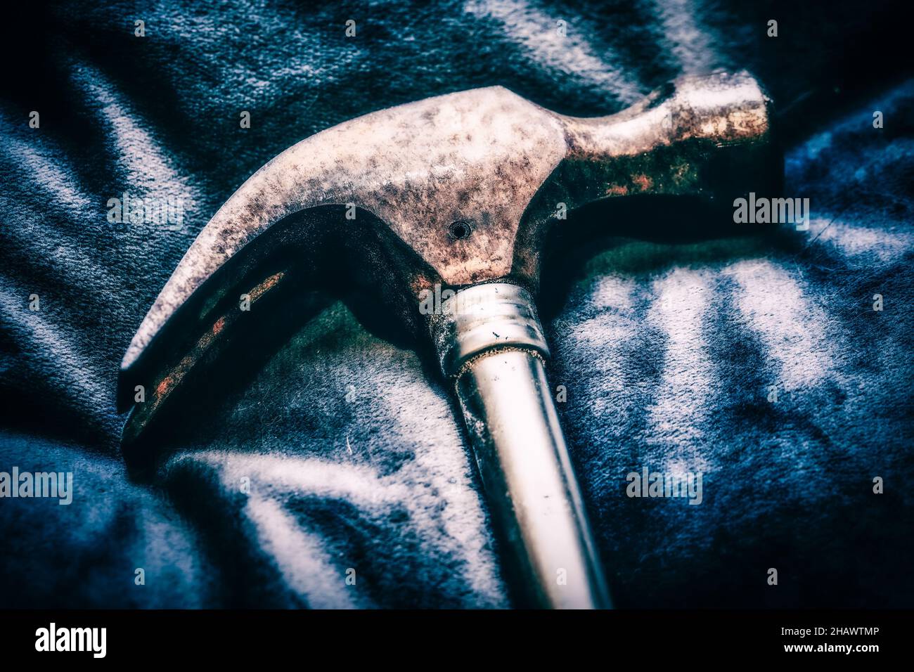 Macro photography, side view of a shiny steel claw hammer, hand tool on ...