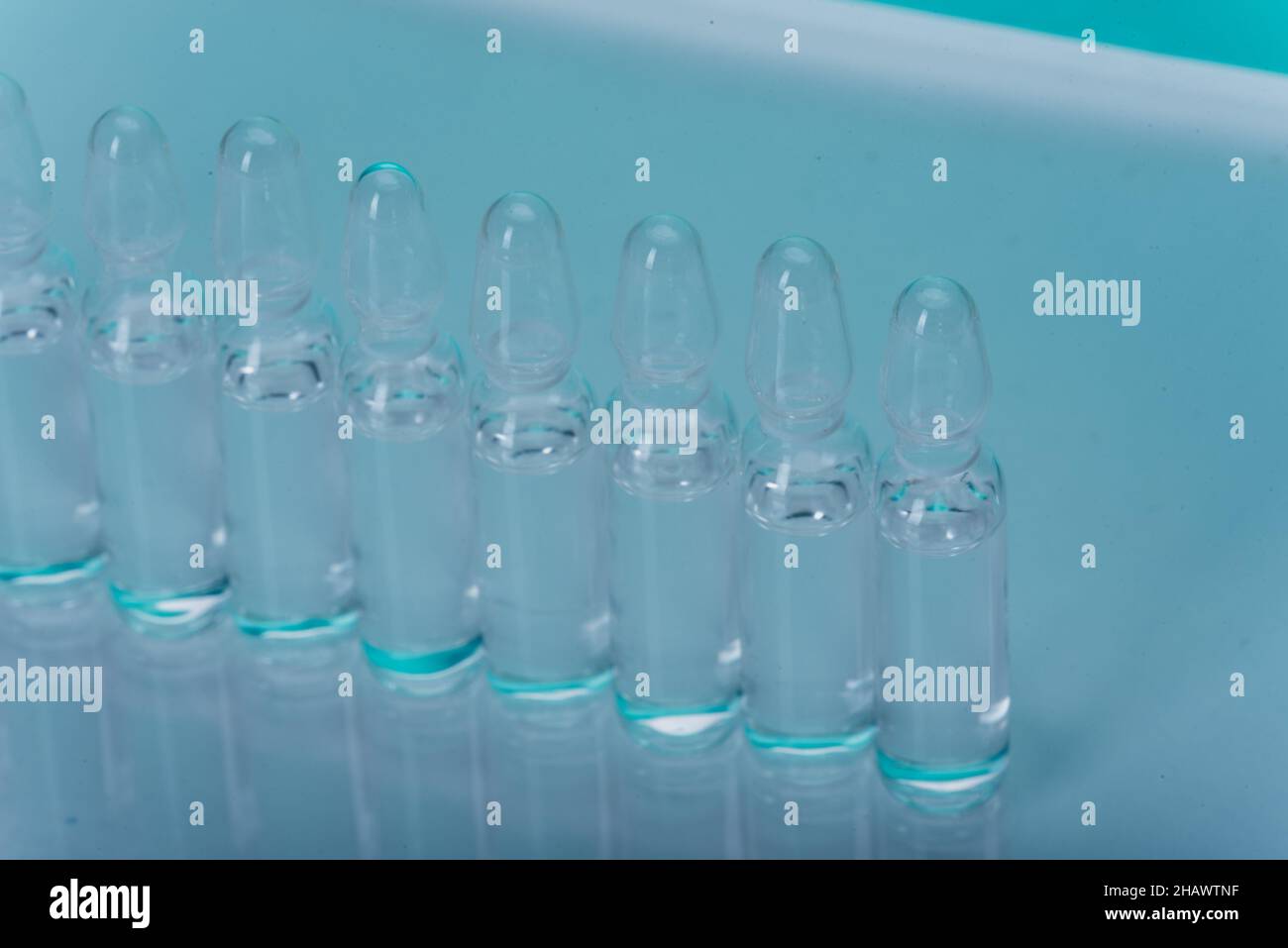 Glass medical ampoule vial for injection. Medicine is liquid sodium ...
