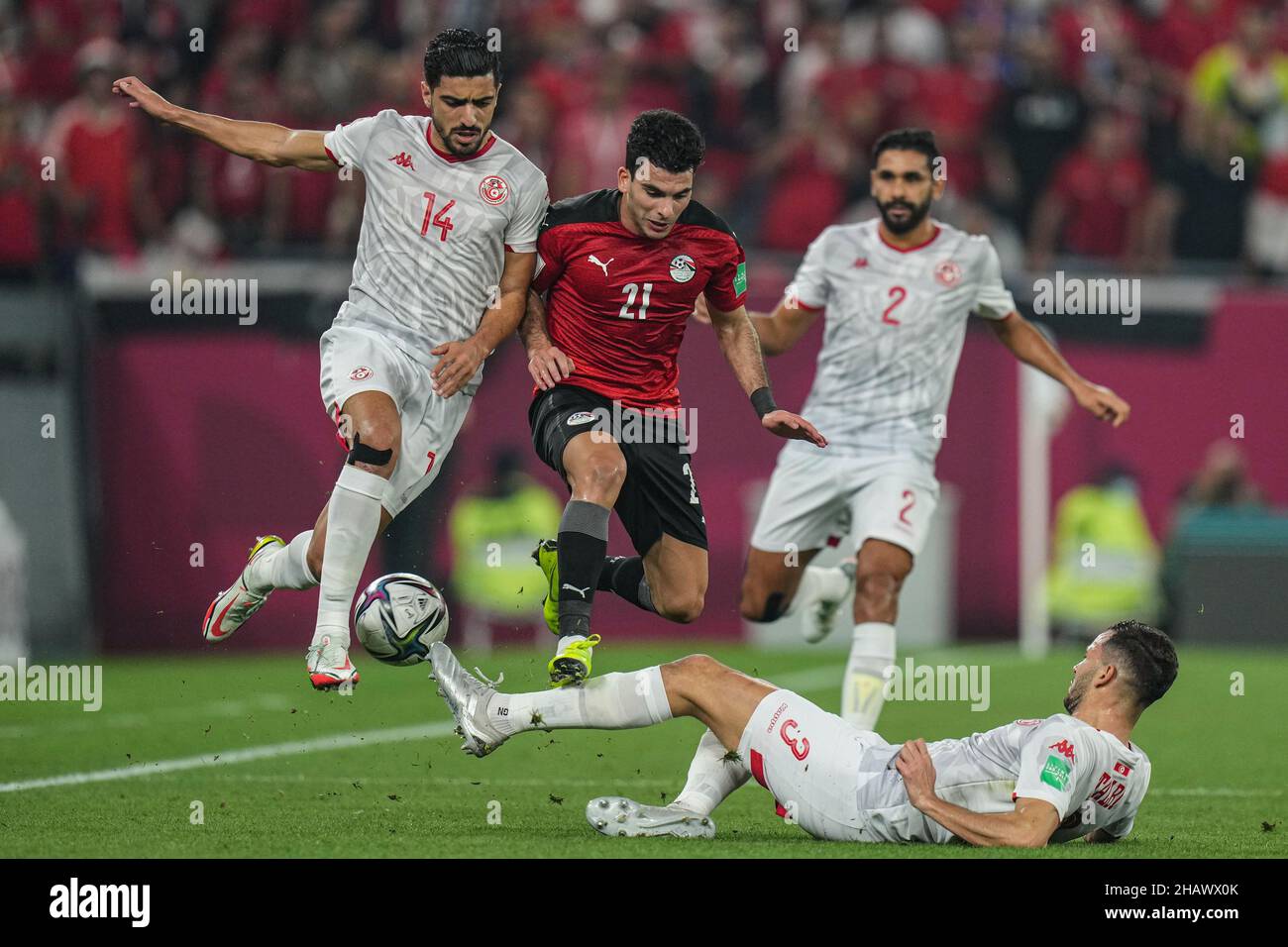 Doha, Qatar. 15th Dec, 2021. Tunisia's Mohamed Amine Ben Hamida (L) and ...