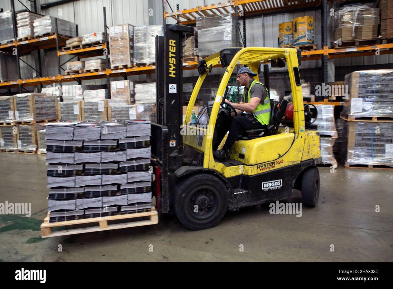Pallets of magazines get moved around the factory during the binding ...