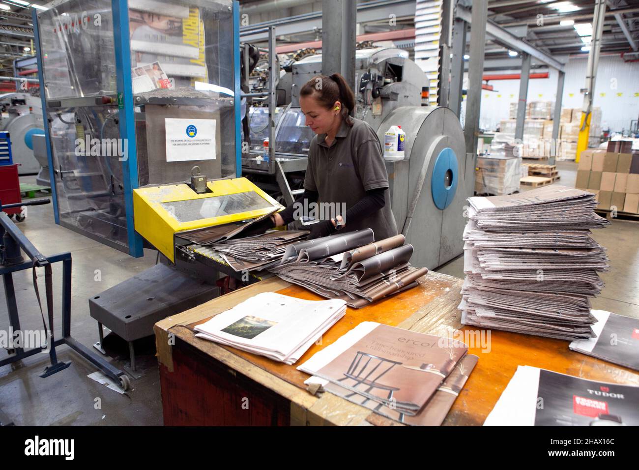 Karazyne Ochab (Lead Bindery Assistant) inspects the new Guardian ...