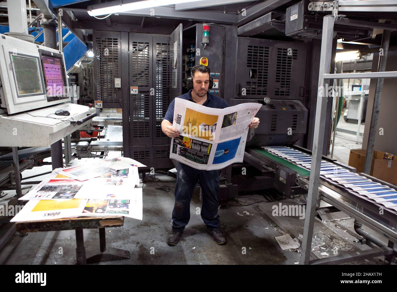 Mark Richardson (number one press operator) does a copy inspection of ...
