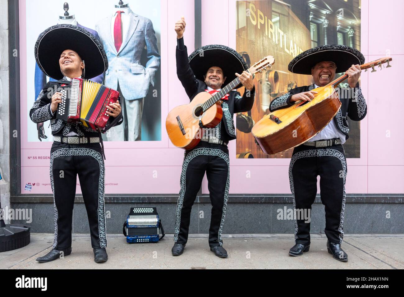 Mexican band members seen performing festive music in traditional ...