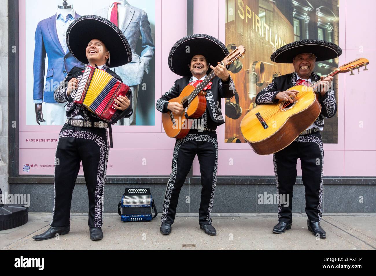 Mexican band members seen performing festive music in traditional ...