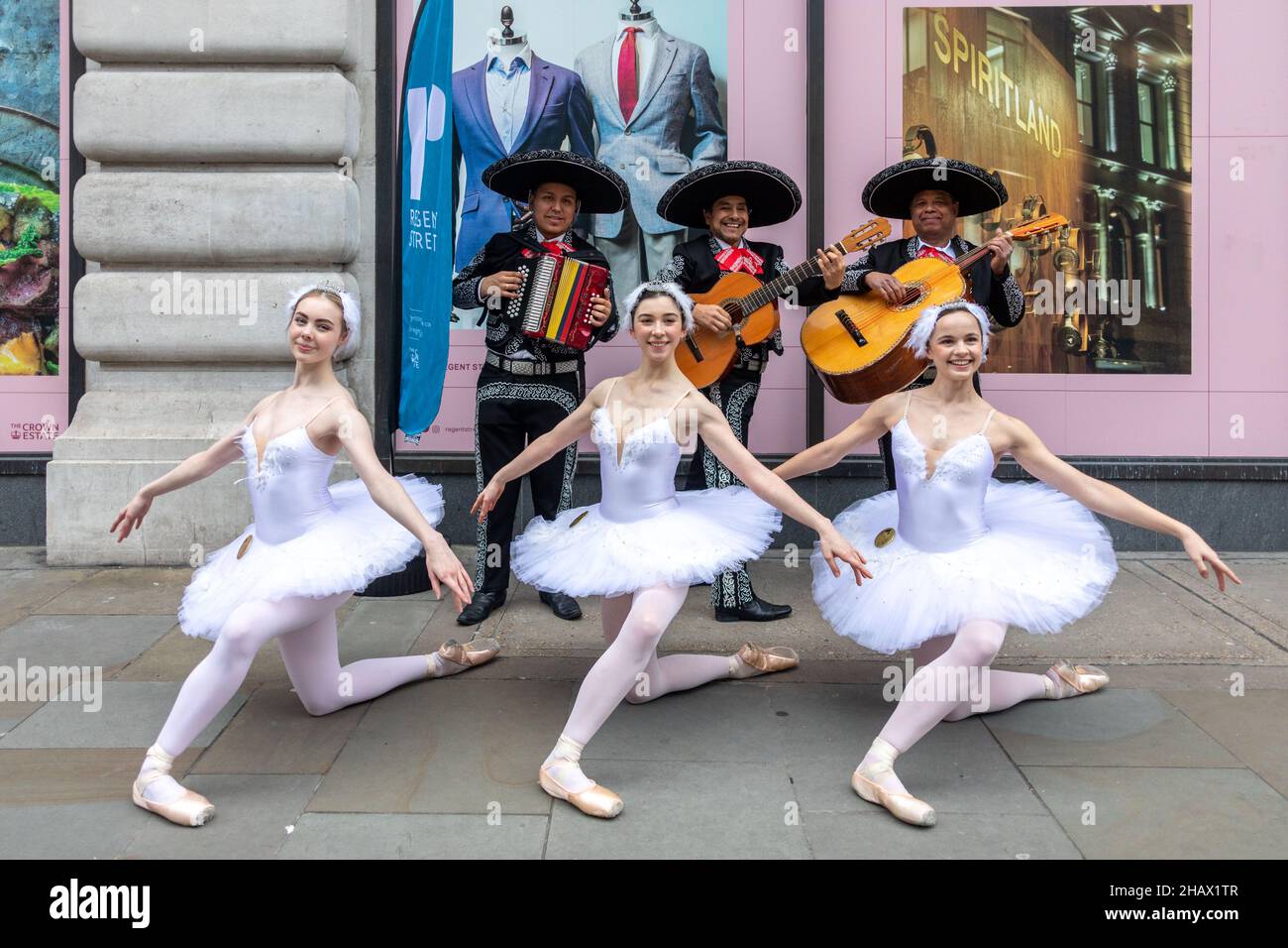 Ballerinas and Mexican band members pose at Piccadilly Circus.Black ...