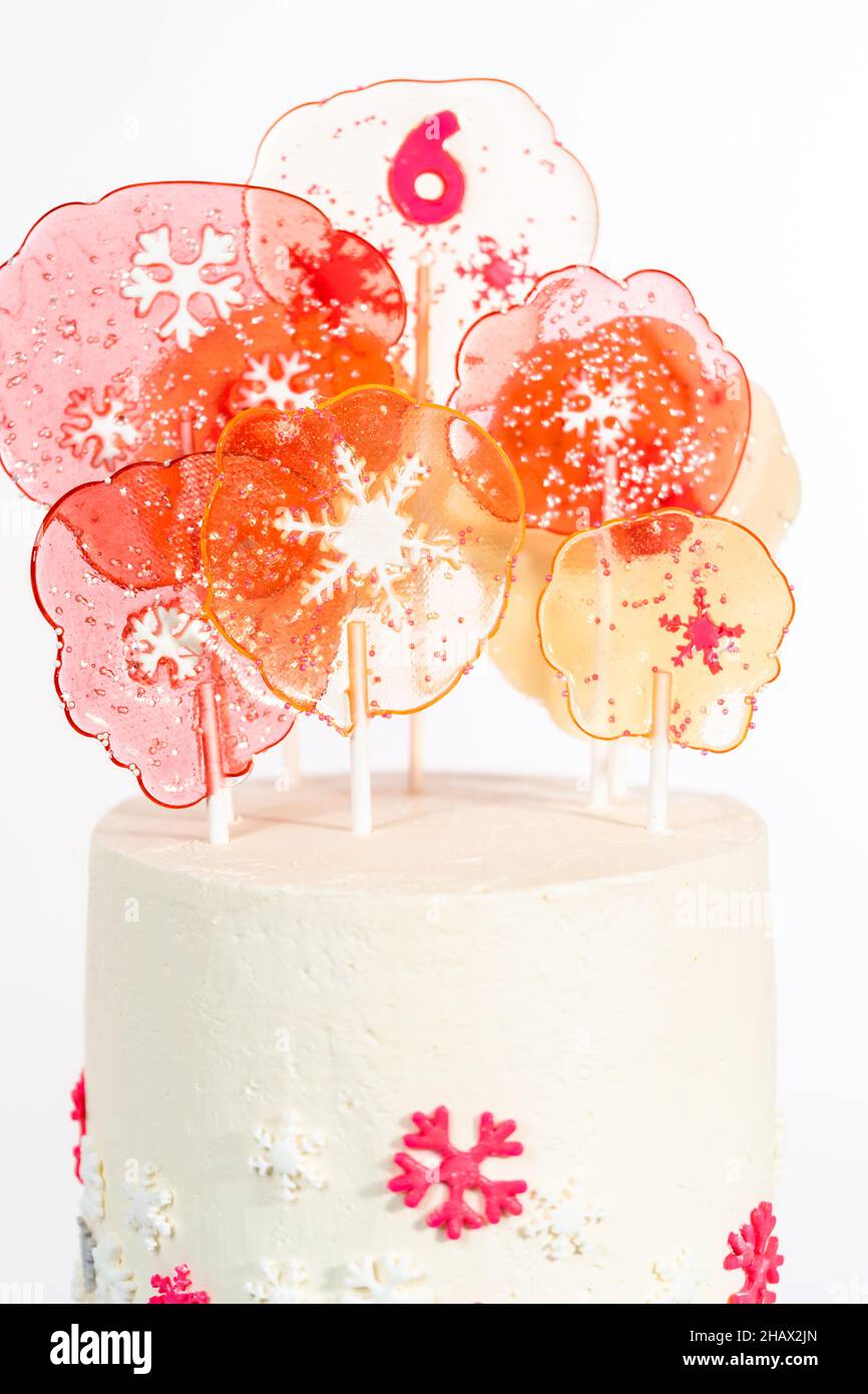Tall round cake with Italian buttercream frosting decorated with ...